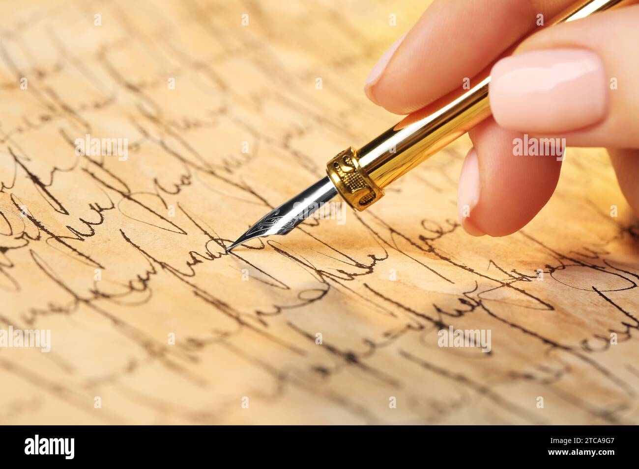 Woman writing letter with fountain pen, closeup Stock Photo - Alamy
