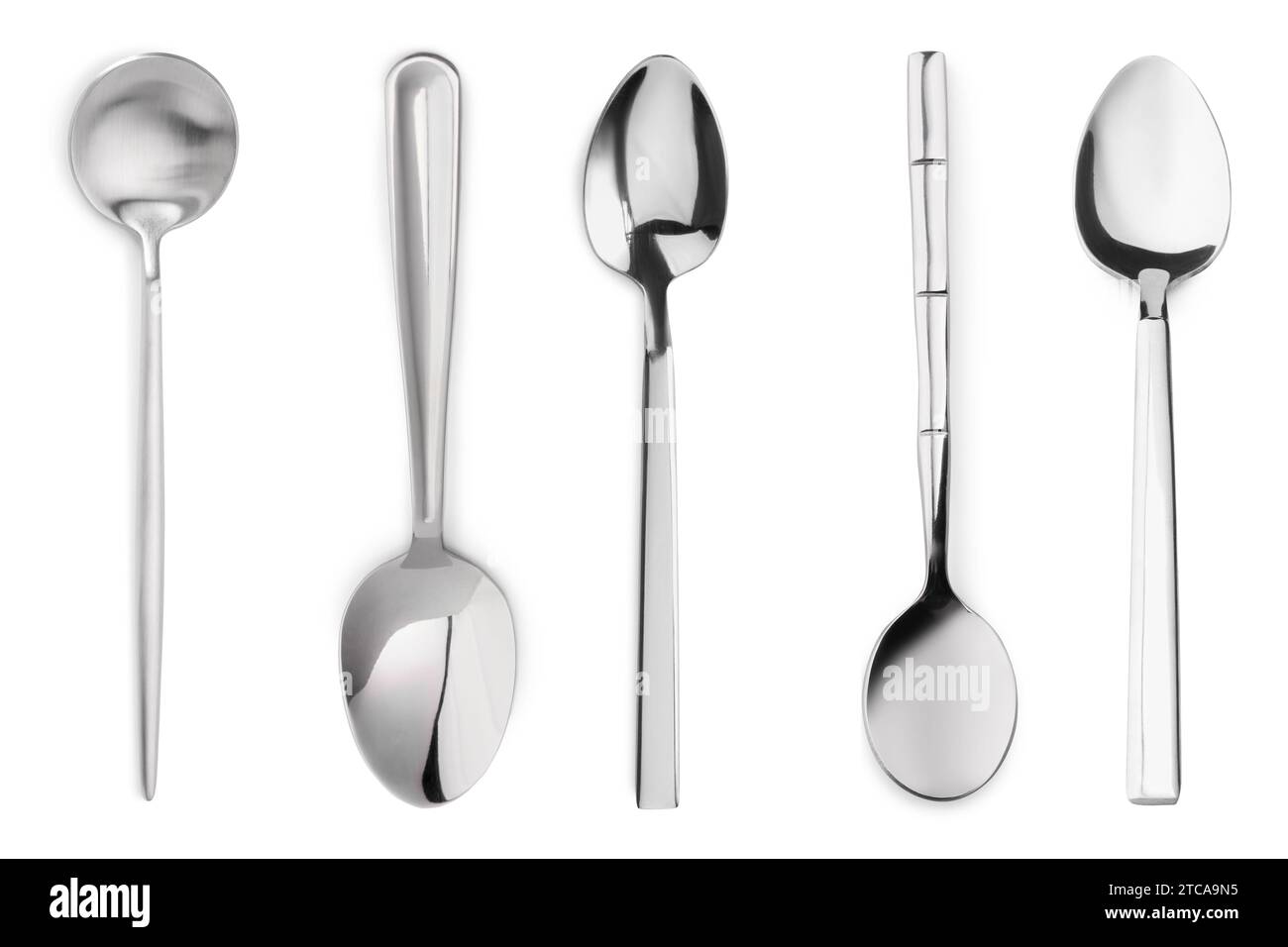 Different stylish silver spoons on white background Stock Photo - Alamy