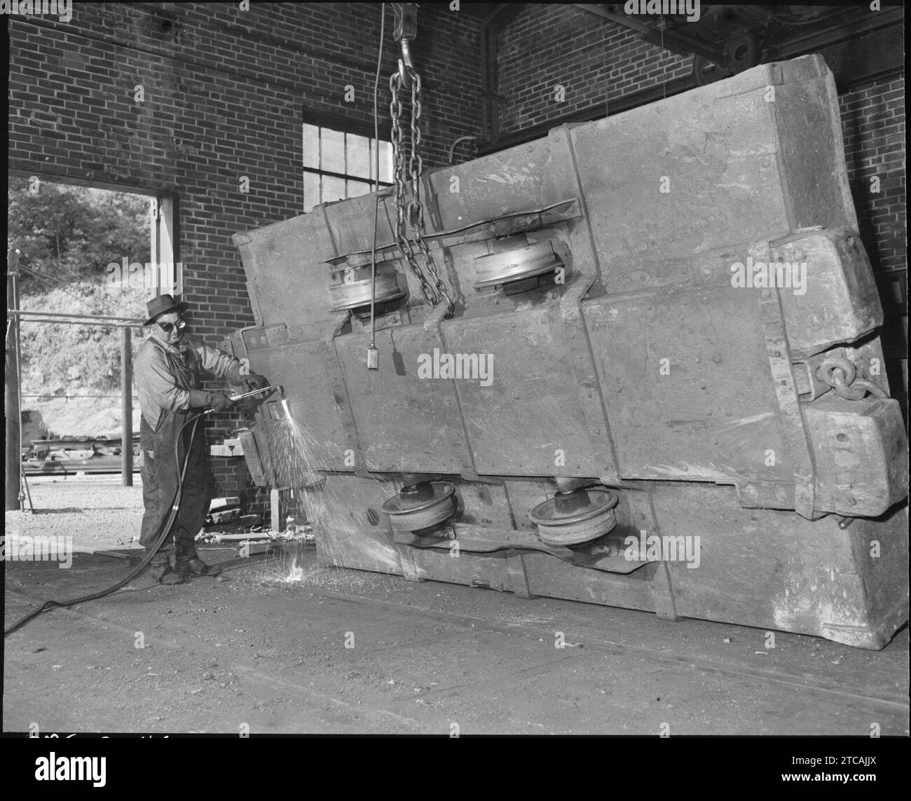 Welding a coal shuttle car in machine shop. The Pocahontas Corporation ...