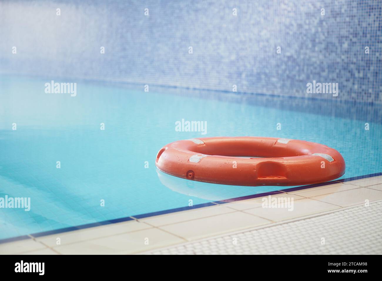 Red life buoy in swimming pool.. Help and support concept Stock Photo ...