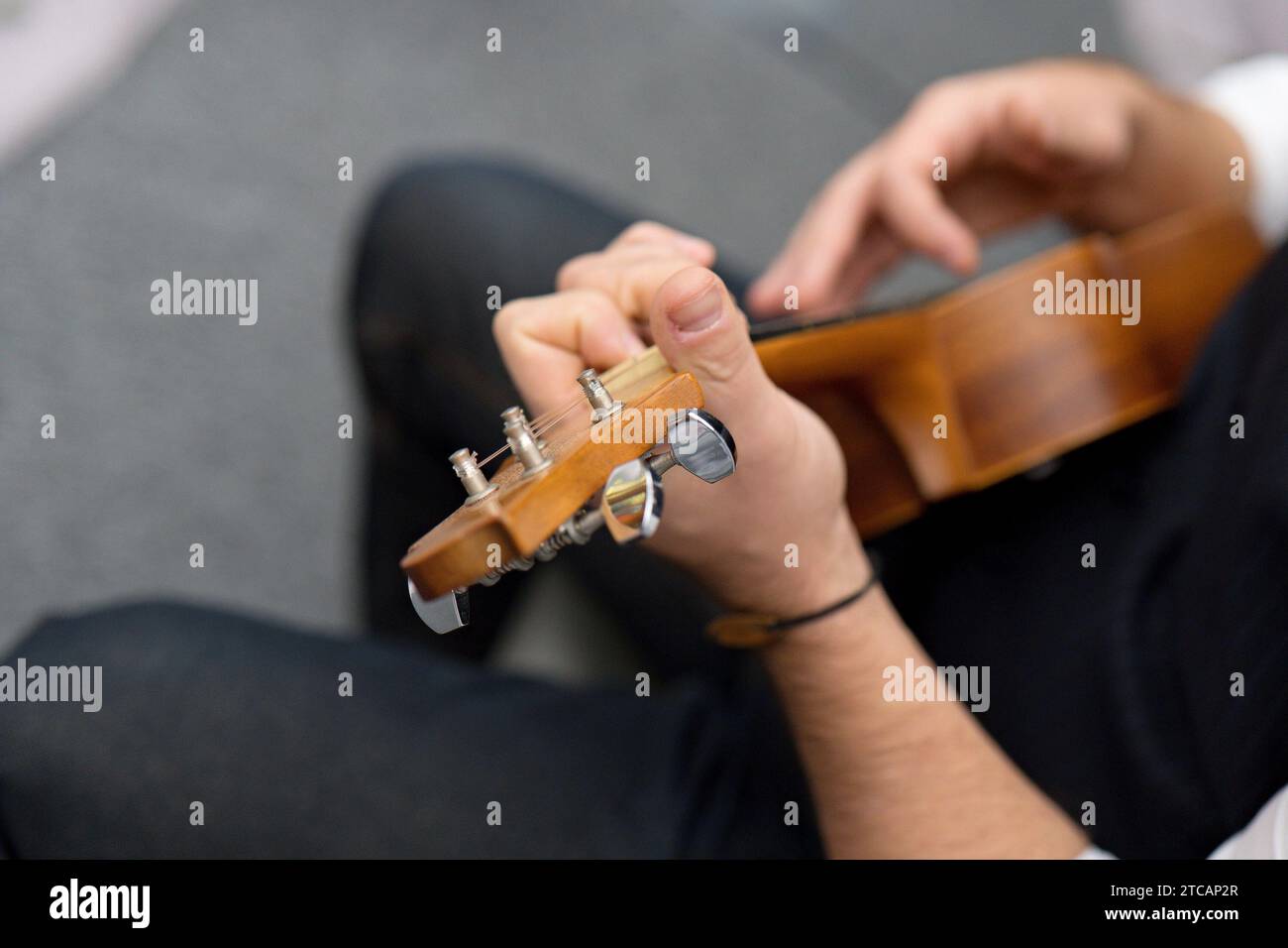 Ukulele man playing instrument close hi-res stock photography and ...