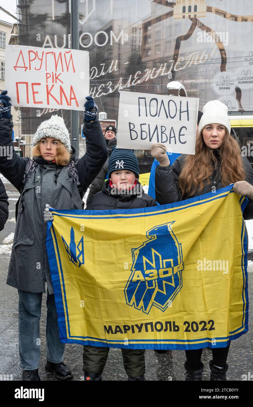 Families and relatives of POWs of the Azov regiment hold a banner and ...