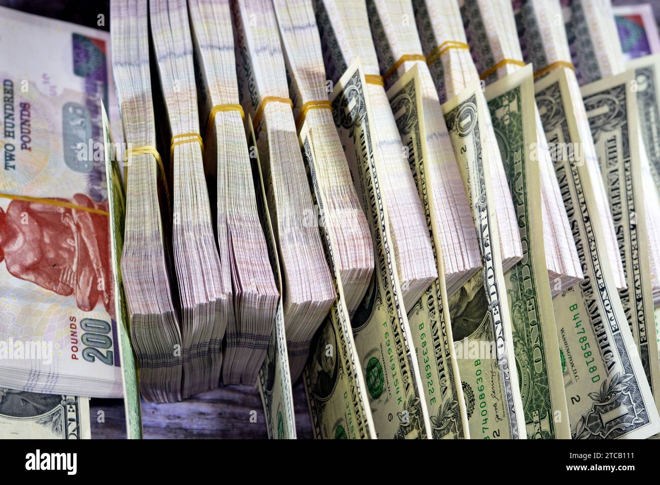 Two piles of cash bills hi-res stock photography and images - Alamy