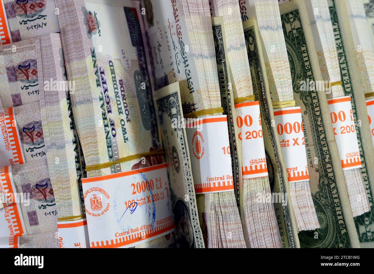 Two piles of cash bills hi-res stock photography and images - Alamy