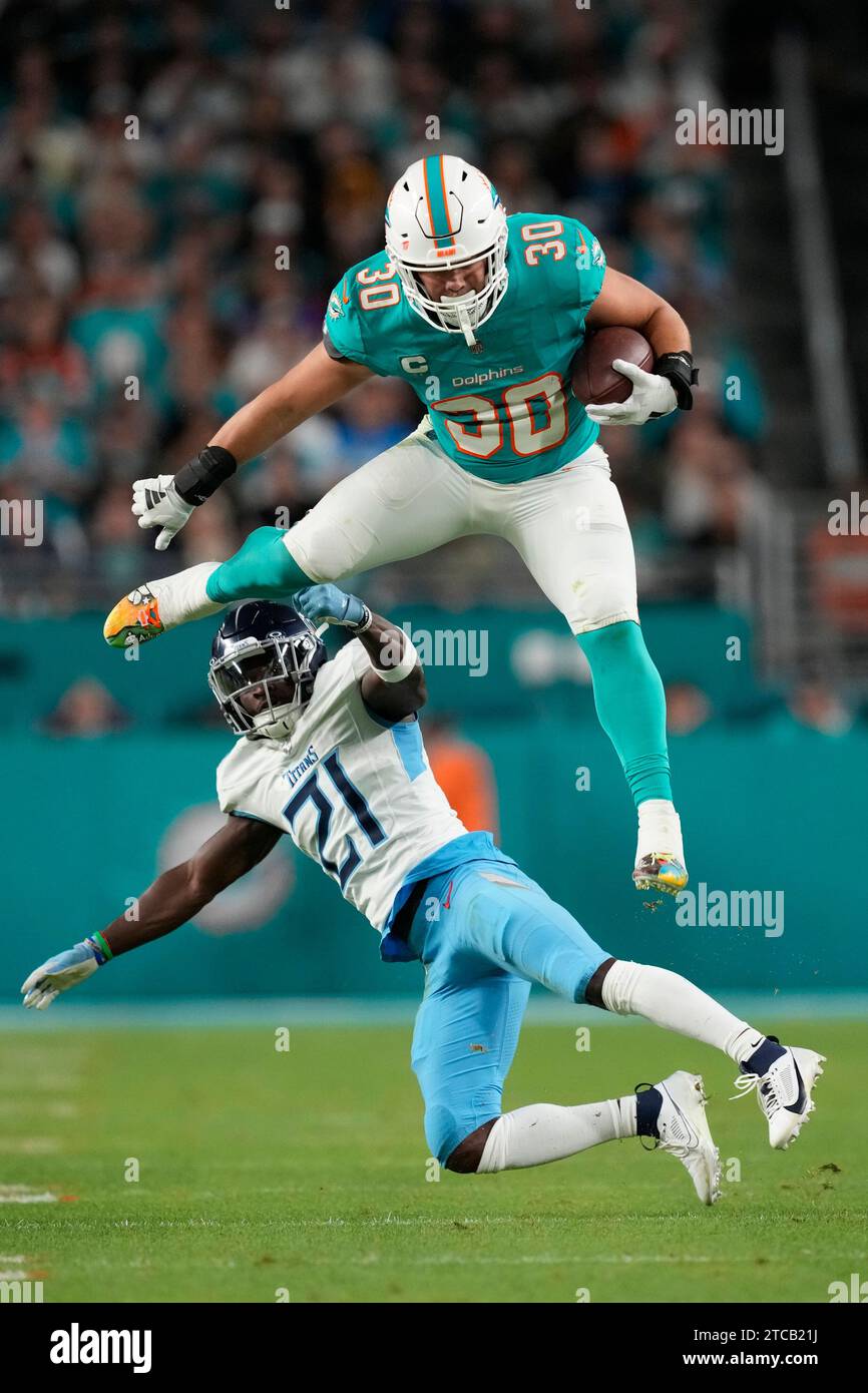 Miami Dolphins fullback Alec Ingold (30) jumps over Tennessee Titans ...
