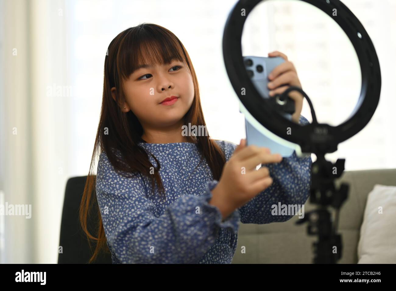 Confident asian girl recording hi-res stock photography and images - Alamy
