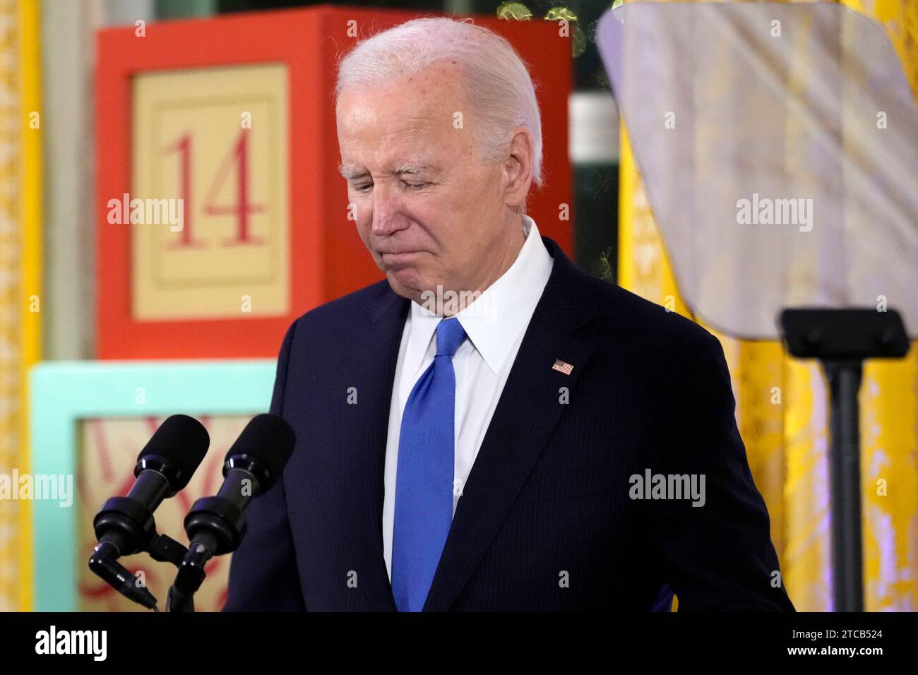 United States President Joe Biden pauses as he speaks at a Hanukkah ...