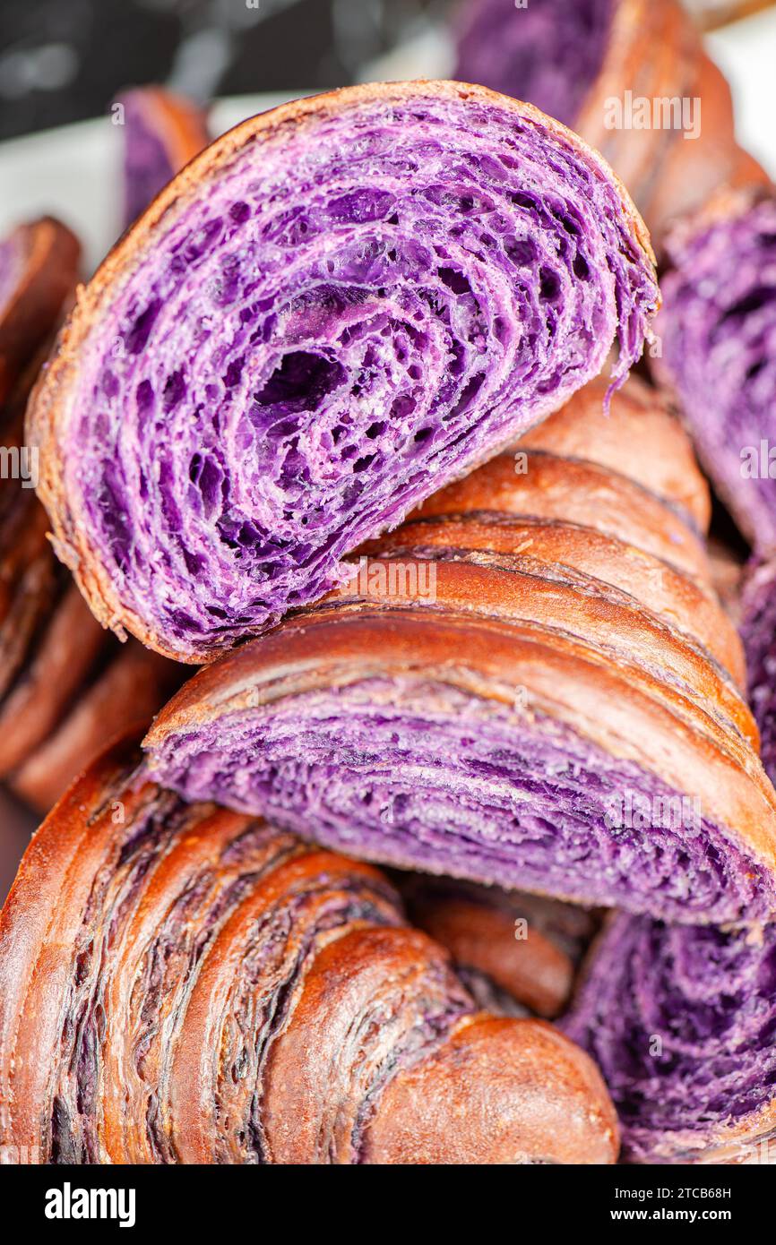 Fresh baked homemade Ube Croissant using traditional flavouring Stock ...