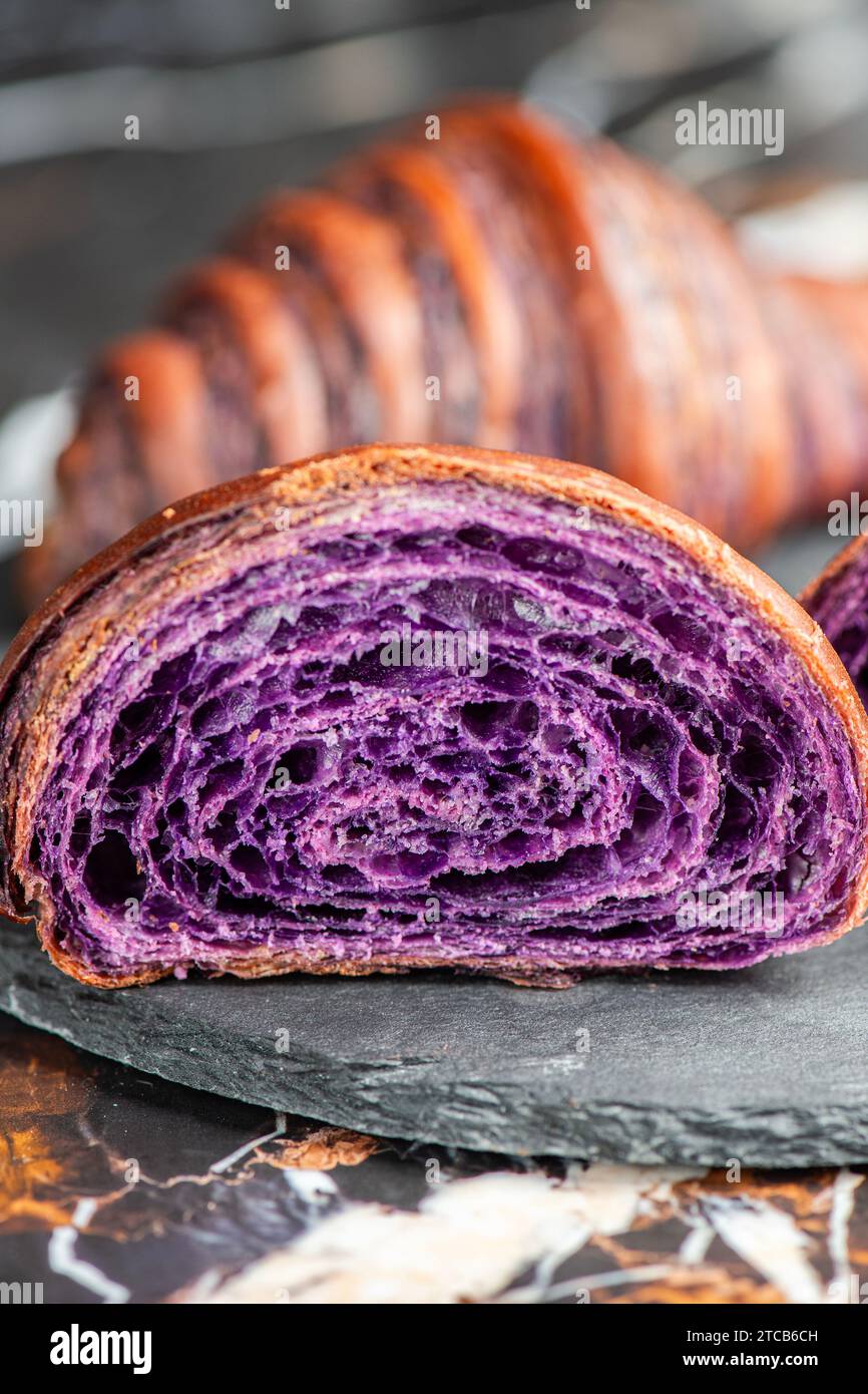 Fresh baked homemade Ube Croissant using traditional flavouring Stock ...