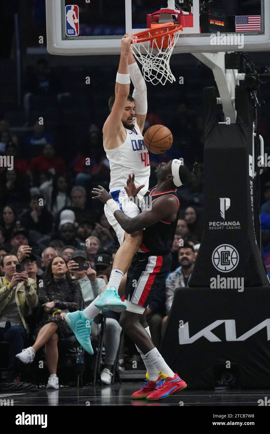 LA Clippers center Ivica Zubac (40) dunks over Portland Trail Blazers ...