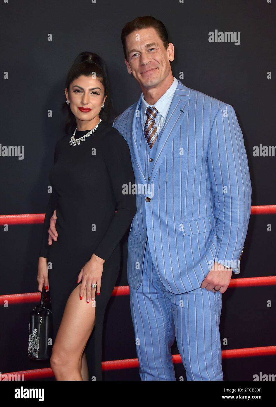 Shay Shariatzadeh, left, and John Cena attend the premiere of "The Iron ...
