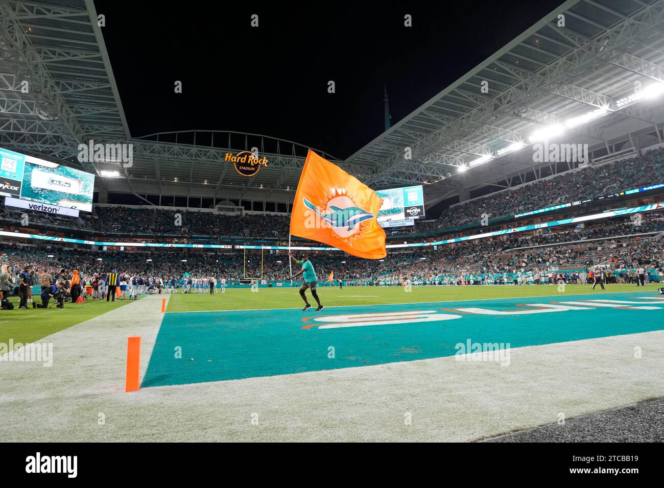 A flag is run across the end zone after a Miami Dolphins touchdown ...