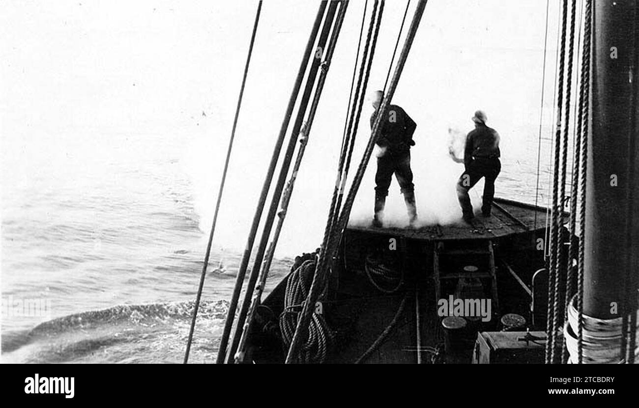 Whalers aboard killer boat firing a harpoon, Alaska, ca 1915 (COBB 48 ...