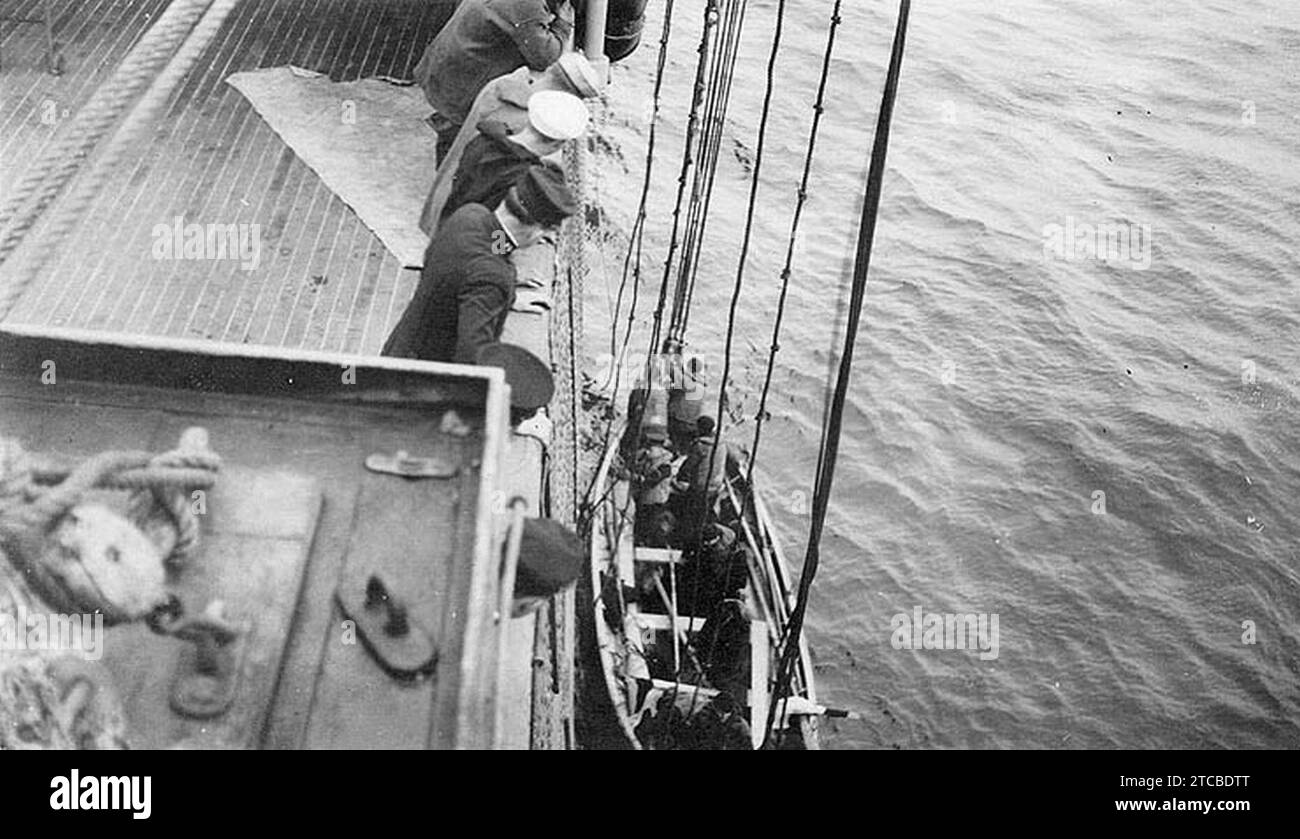 Whaleboat lowered to sea from USS Kroonland, February 1919 Stock Photo ...