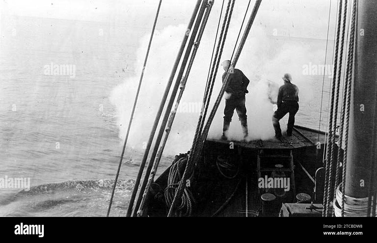 Whalers aboard killer boat firing a harpoon, Alaska, ca 1915 (COBB 54 ...