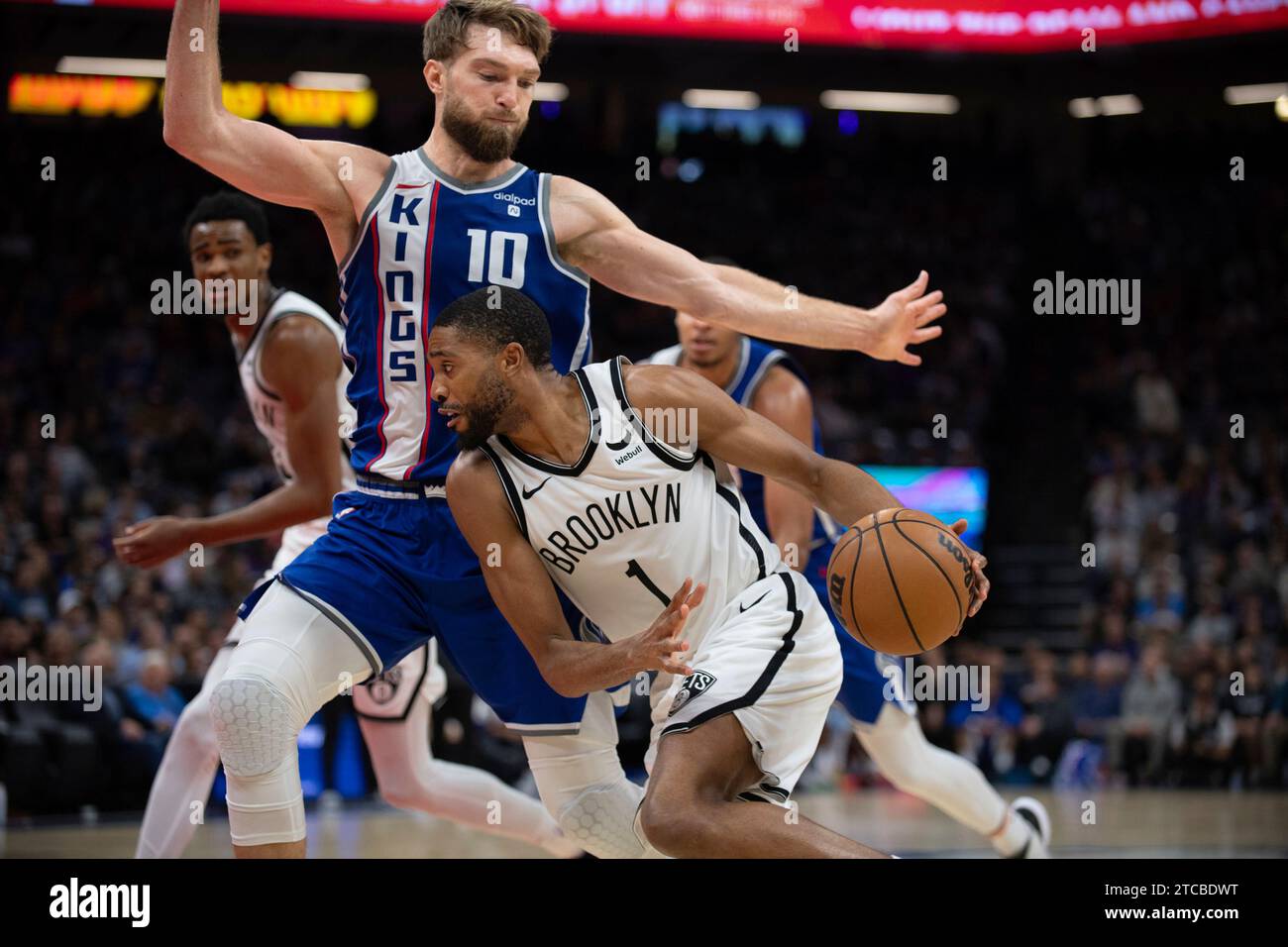 Sacramento Kings forward Domantas Sabonis (10) defends Brooklyn Nets forward Mikal Bridges (1 ...