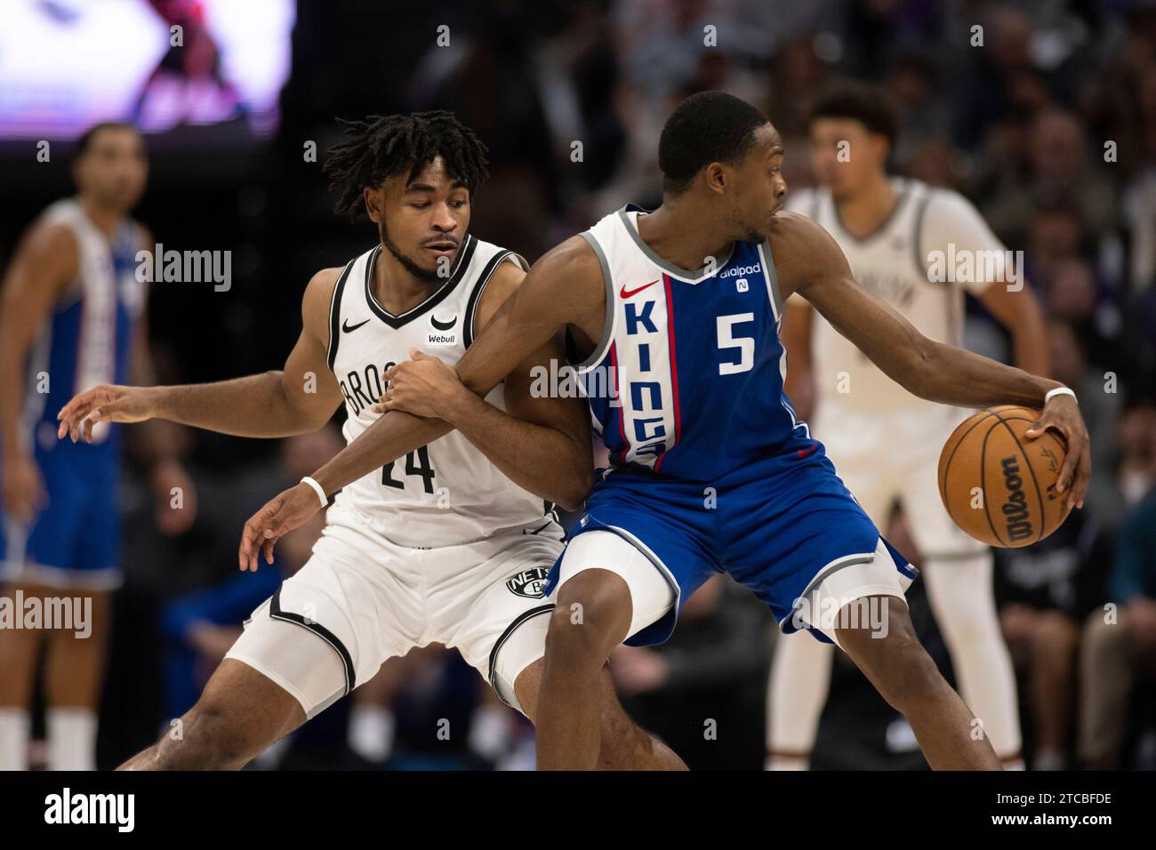 Brooklyn Nets guard Cam Thomas (24) defends Sacramento Kings guard De ...