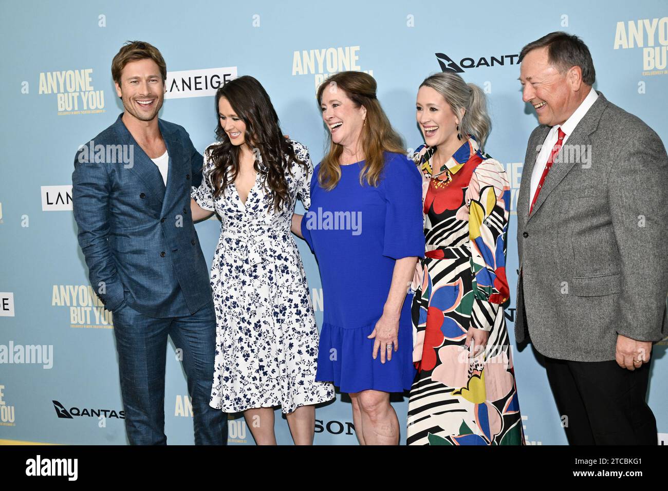 Glen Powell, left, poses with his family at the premiere of "Anyone But ...