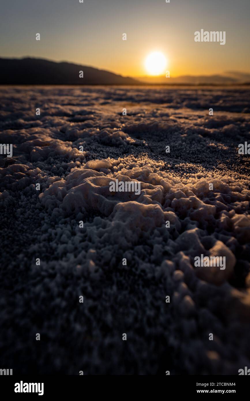 A magnificent sunset over a stunning landscape of salt formations in ...