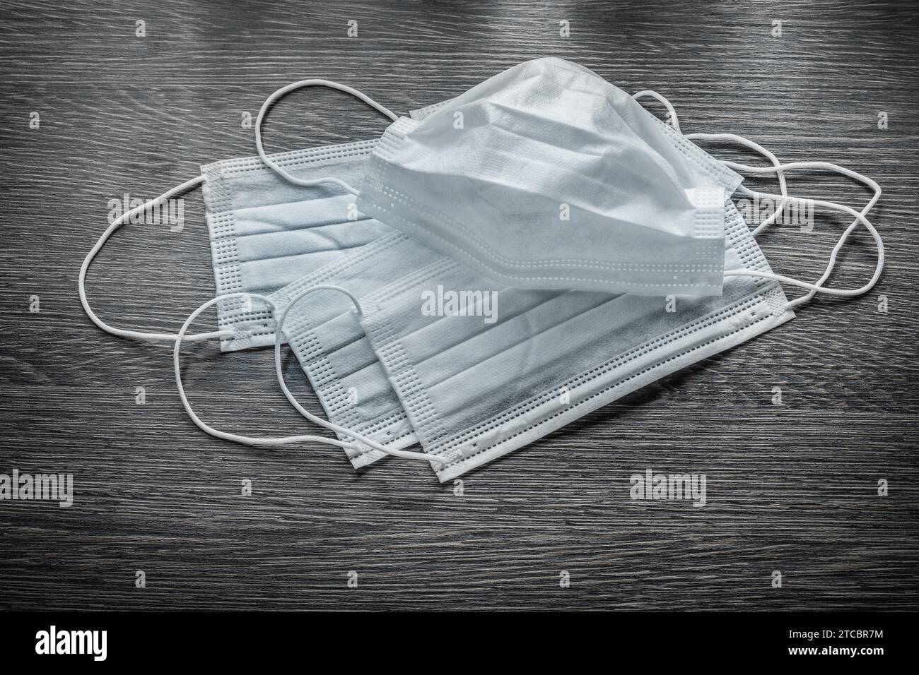 Set of medical sterile masks on vintage wooden board Stock Photo - Alamy