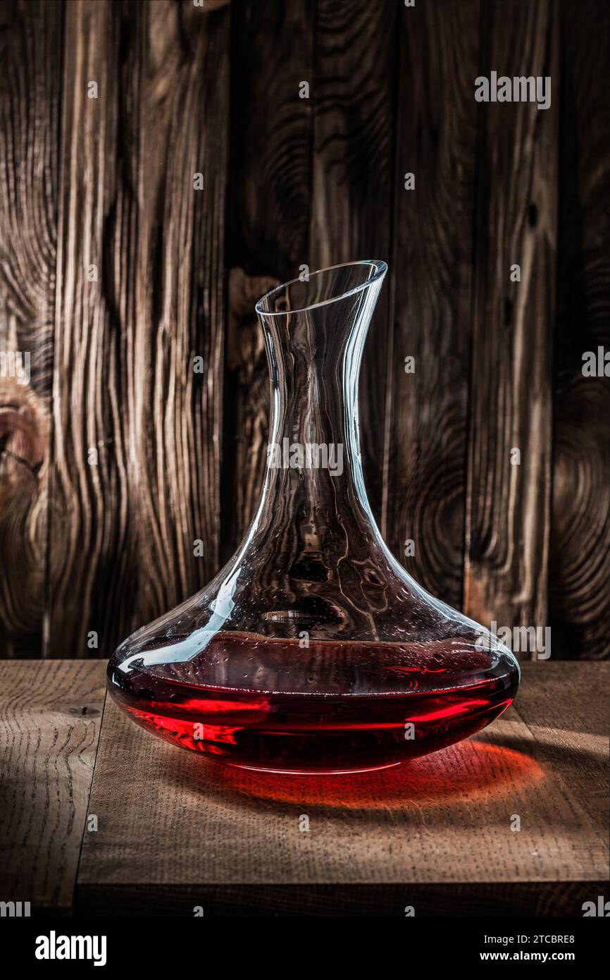 Vertical view decanter with red wine on vintage background Stock Photo ...
