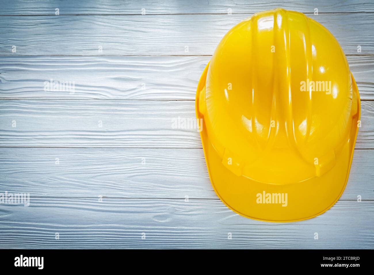 Construction helmet on white panel Top view Stock Photo - Alamy