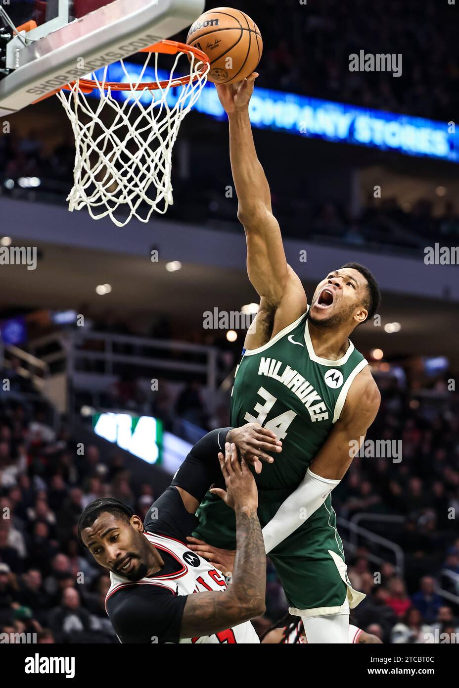 Milwaukee, USA. 11th Dec, 2023. Giannis Antetokounmpo (top) of ...
