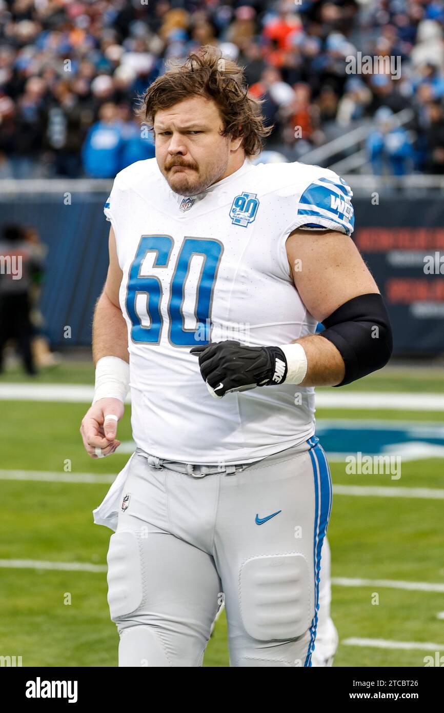 Detroit Lions guard Graham Glasgow (60) walks on the field before an ...