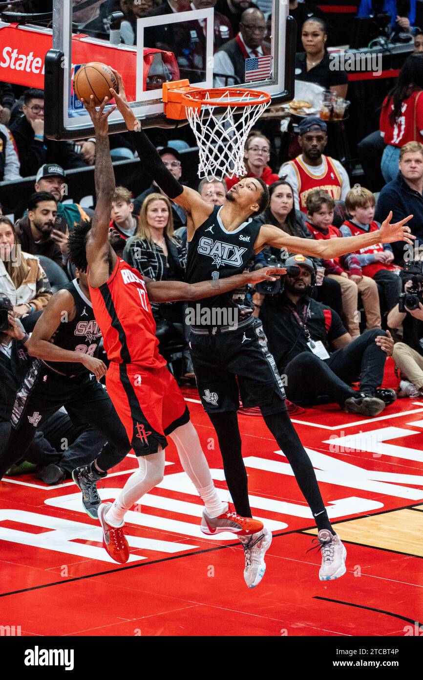 Houston, USA. 11th Dec, 2023. Victor Wembanyama (R) of San Antonio ...