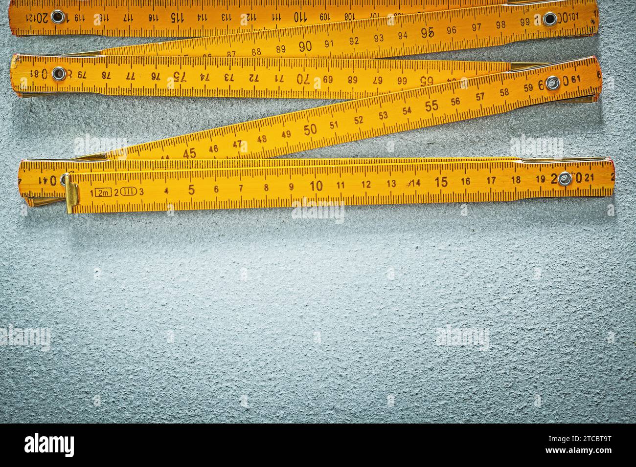 Wooden metres on concrete surface horizontal image Building concept ...