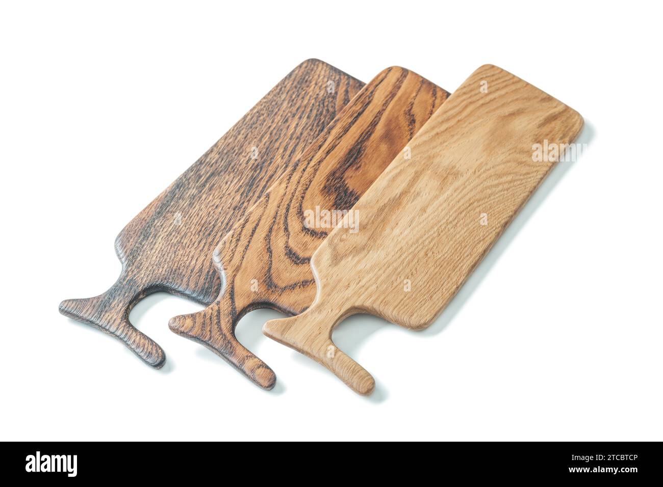 Three oak serving boards against a white background Stock Photo - Alamy