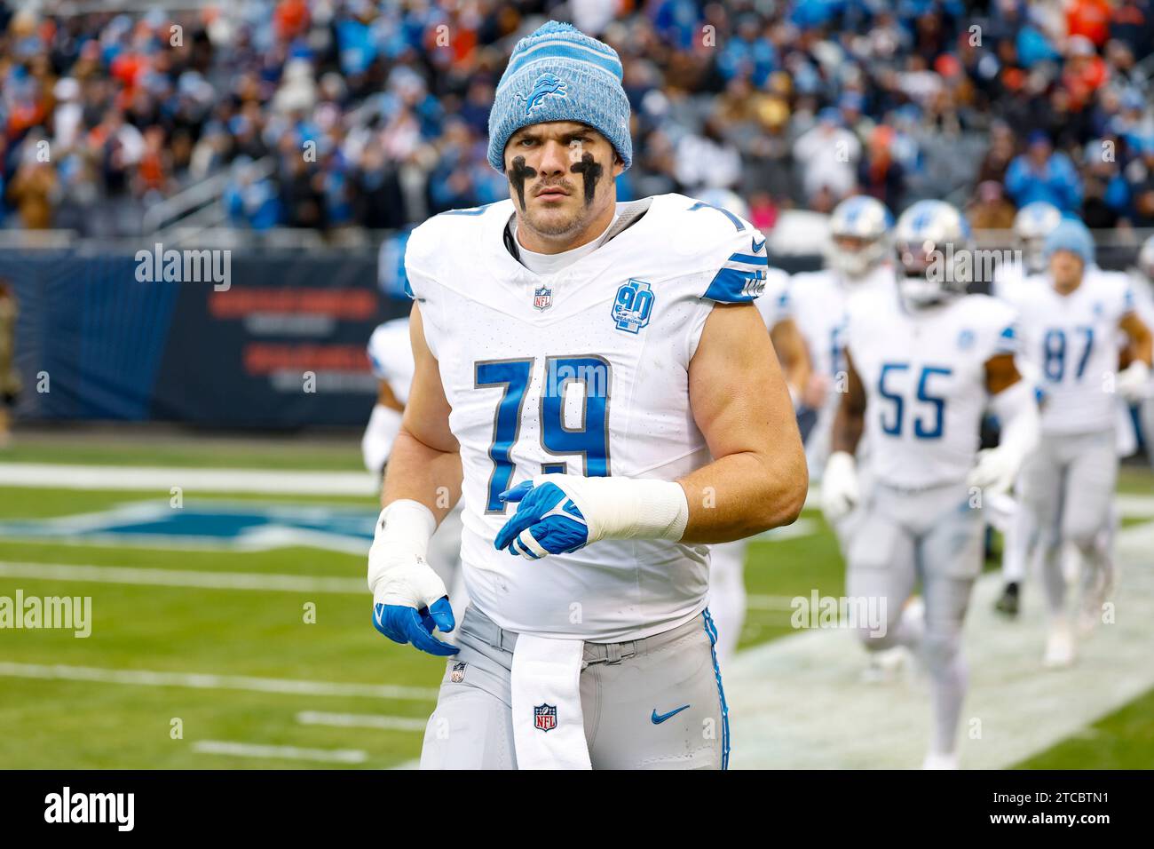 Detroit Lions defensive end John Cominsky (79) walks on the field ...