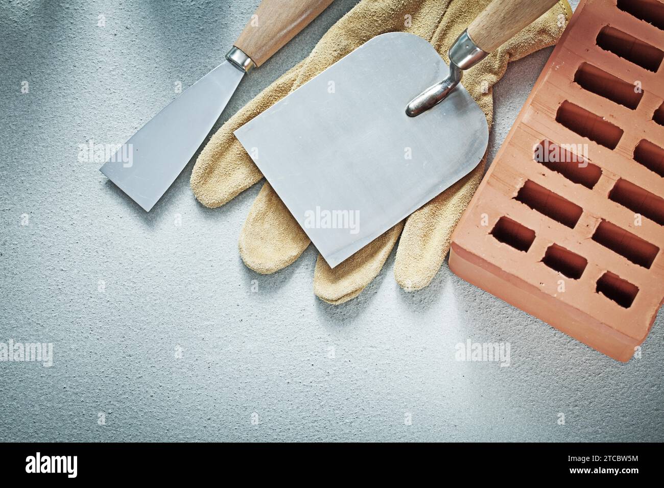 Construction brick leather protective gloves putty knife on concrete ...
