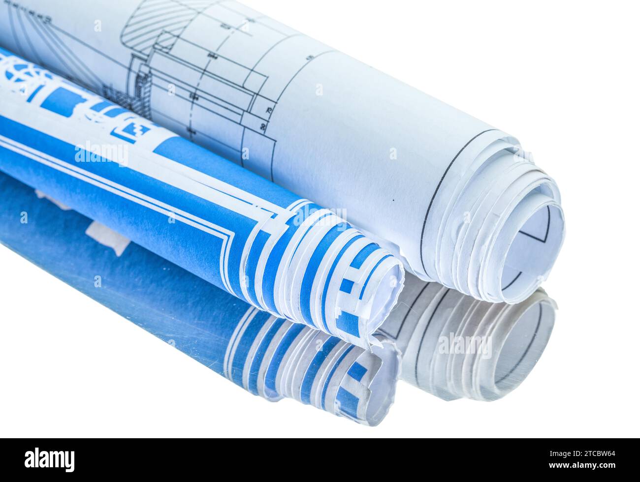 Blue and white rolled blueprints against a white background very close ...