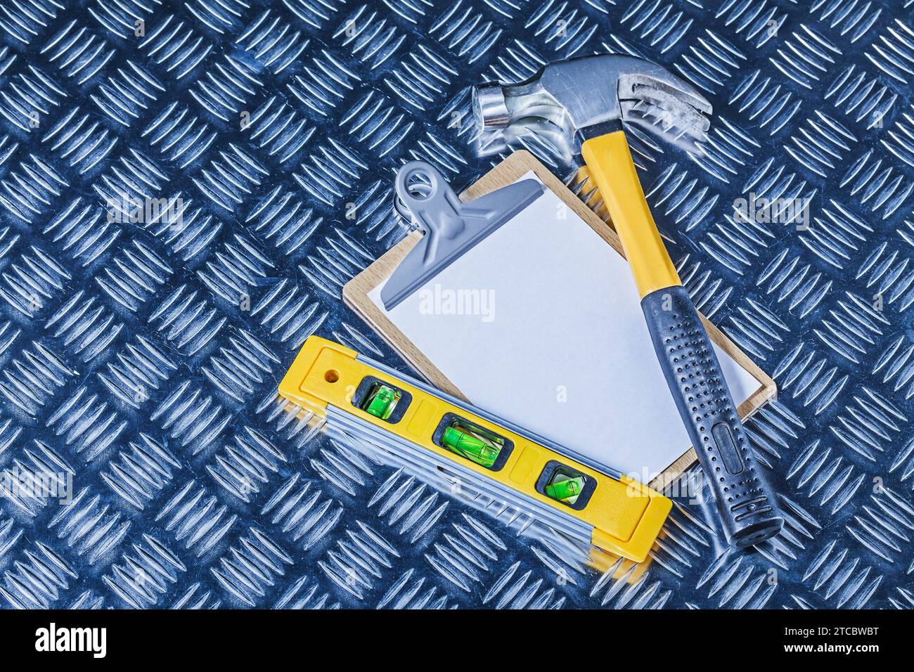 Clamping board for claw hammer and spirit level on corrugated metal ...