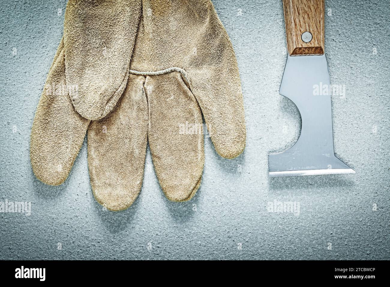 Construction spatula safety gloves on concrete surface Building concept ...