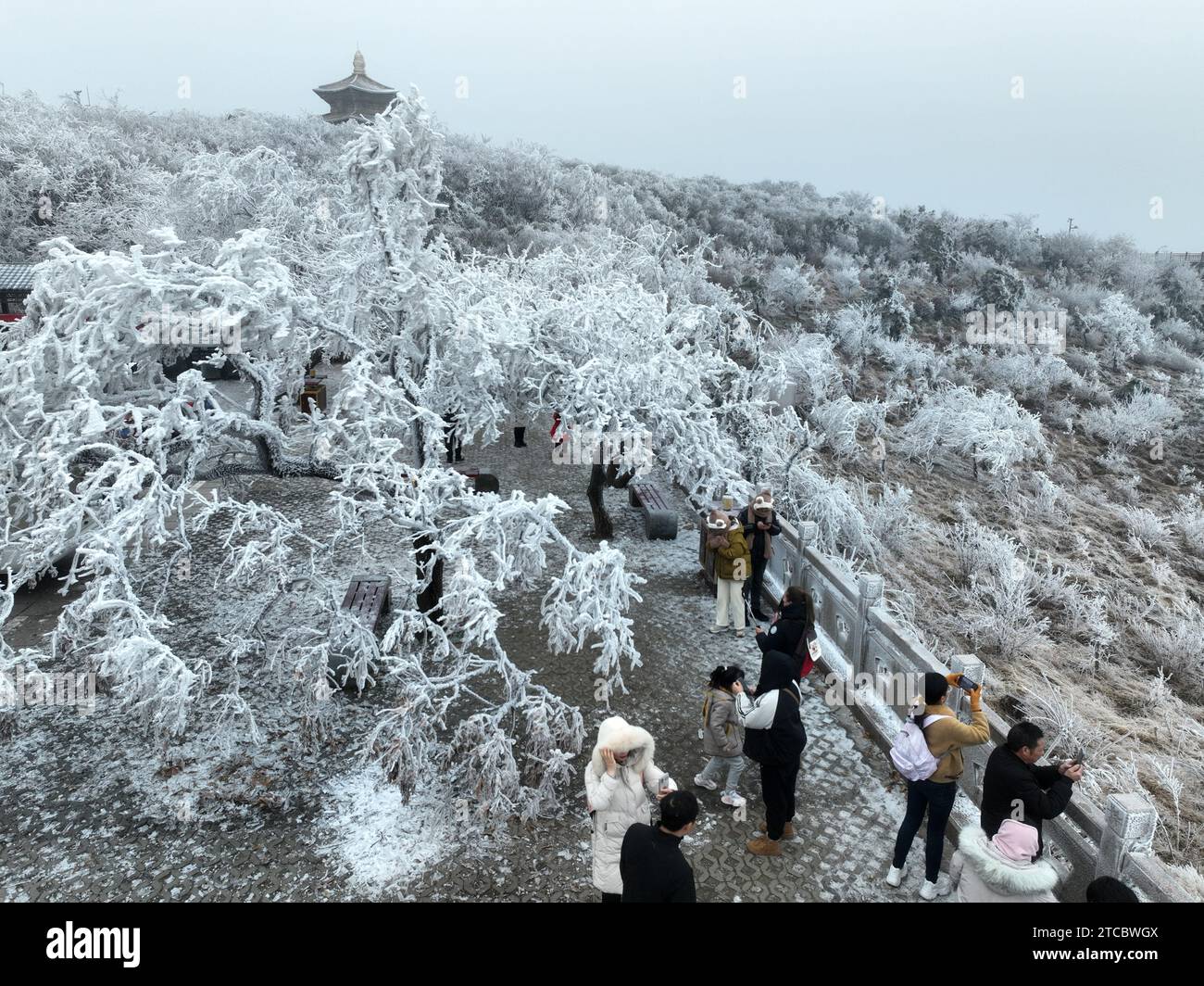 Lianyungang, China. 12th Dec, 2023. Tourists view the rime scenery at ...