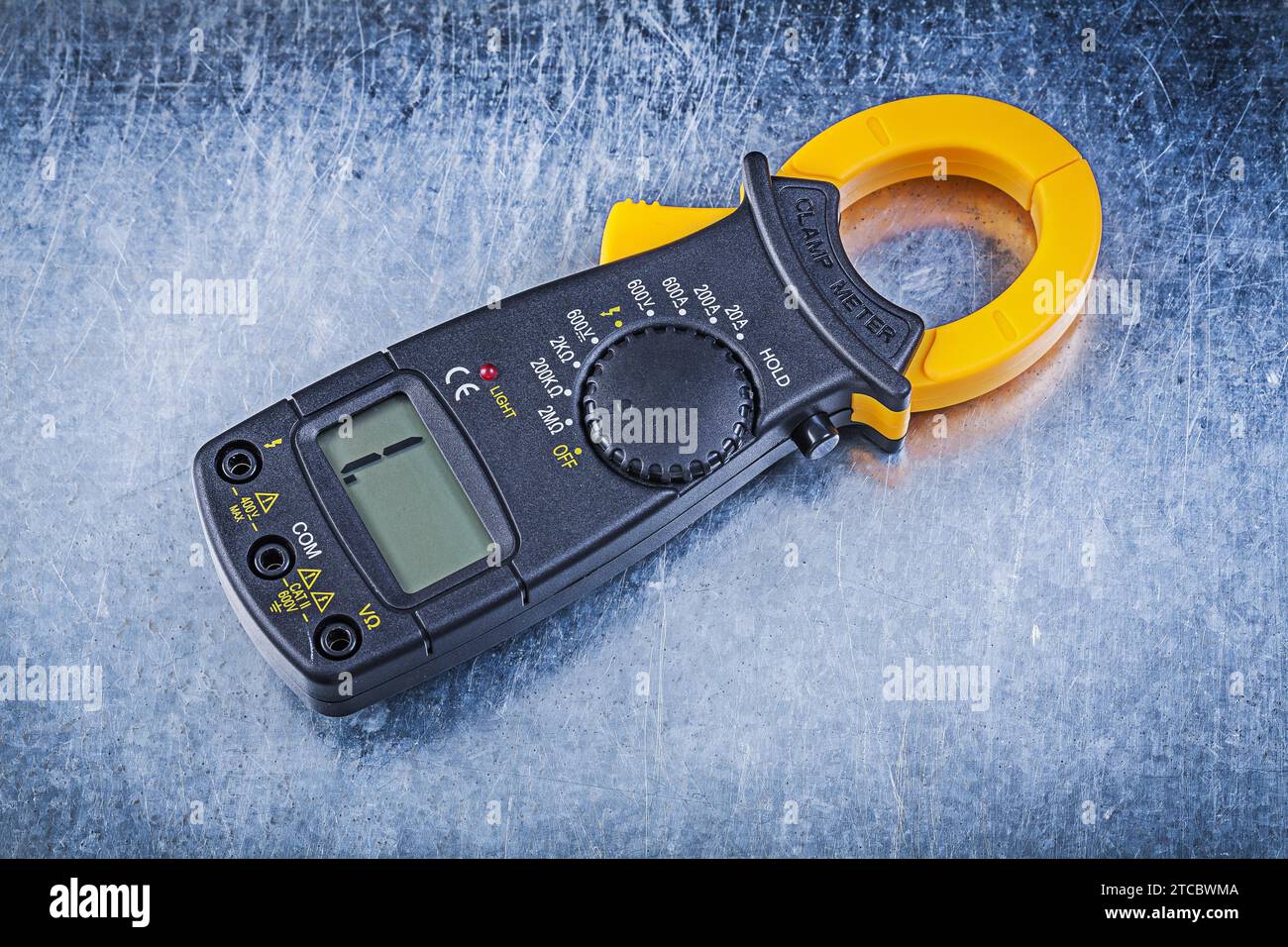 Digital clamp meter on metallic background Electricity concept Stock ...