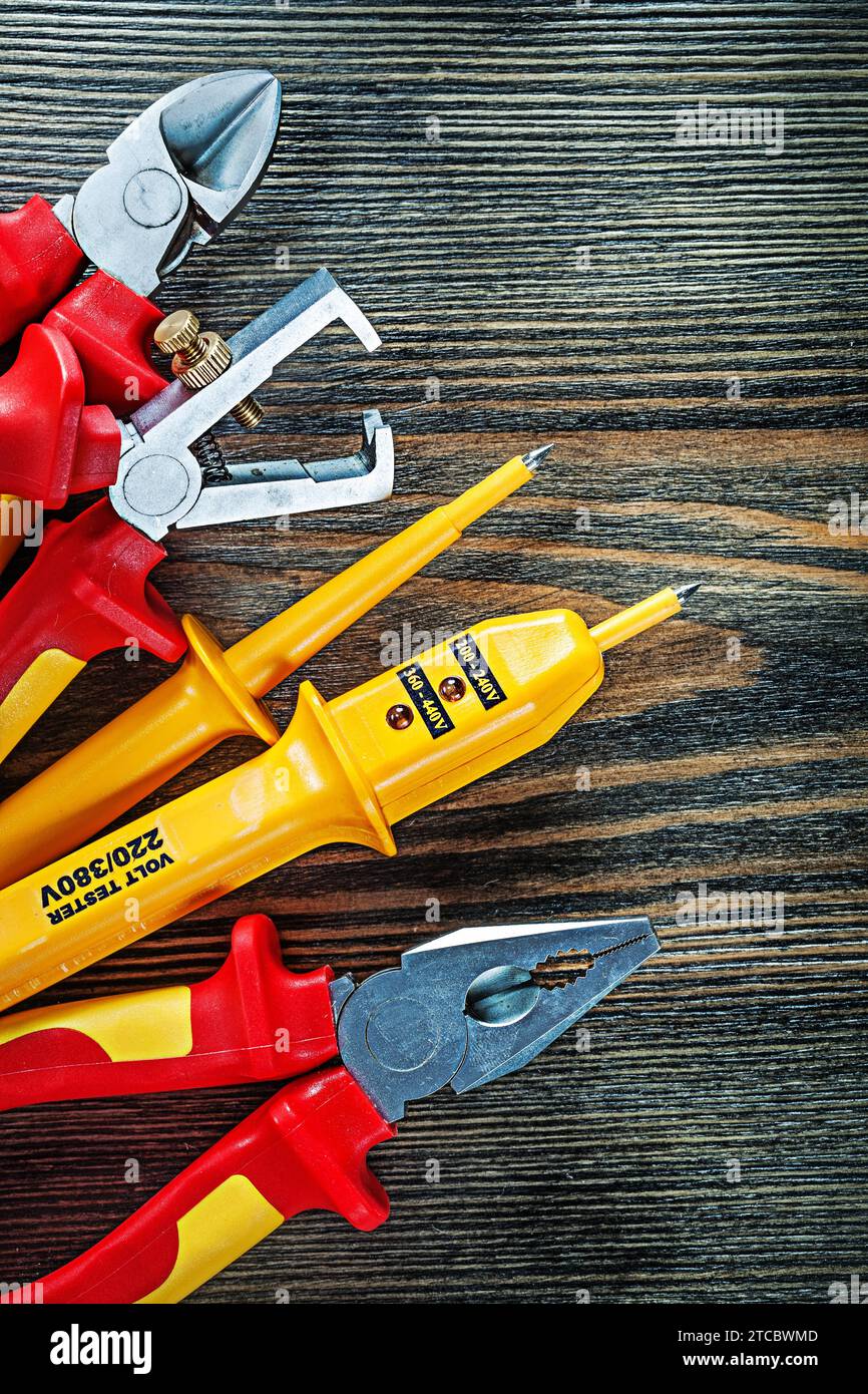 Electrical tester Wire stripper Wire cutter on wooden board Stock Photo ...
