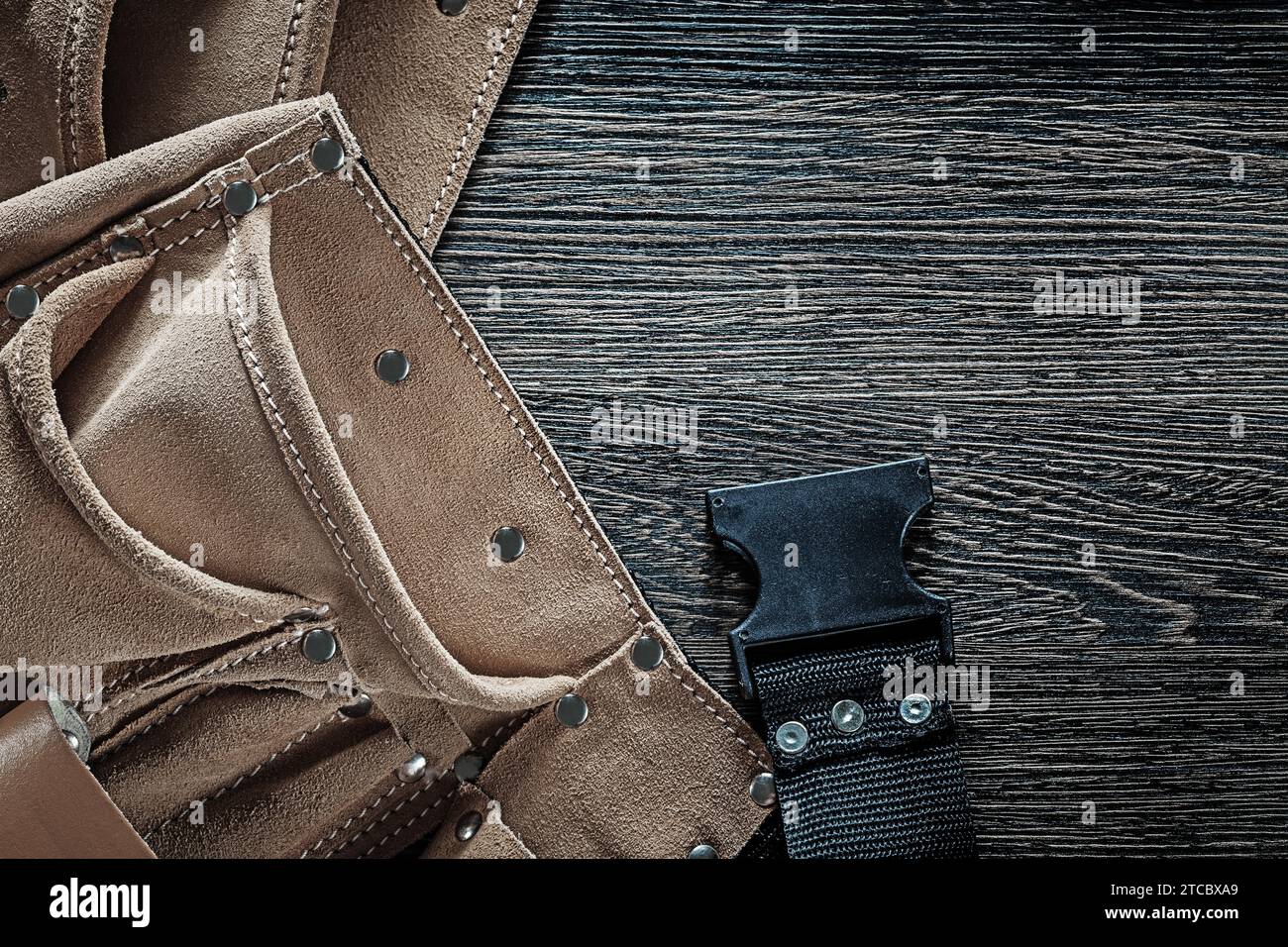 Leather building belt on black cardboard Stock Photo - Alamy