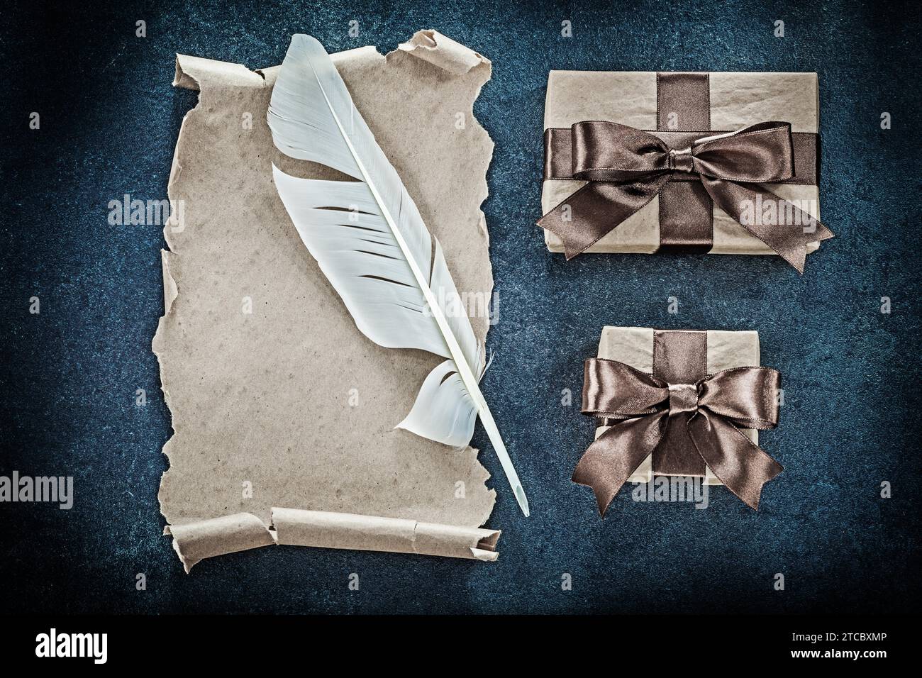 Medieval paper snail gift boxes on a black background Stock Photo - Alamy