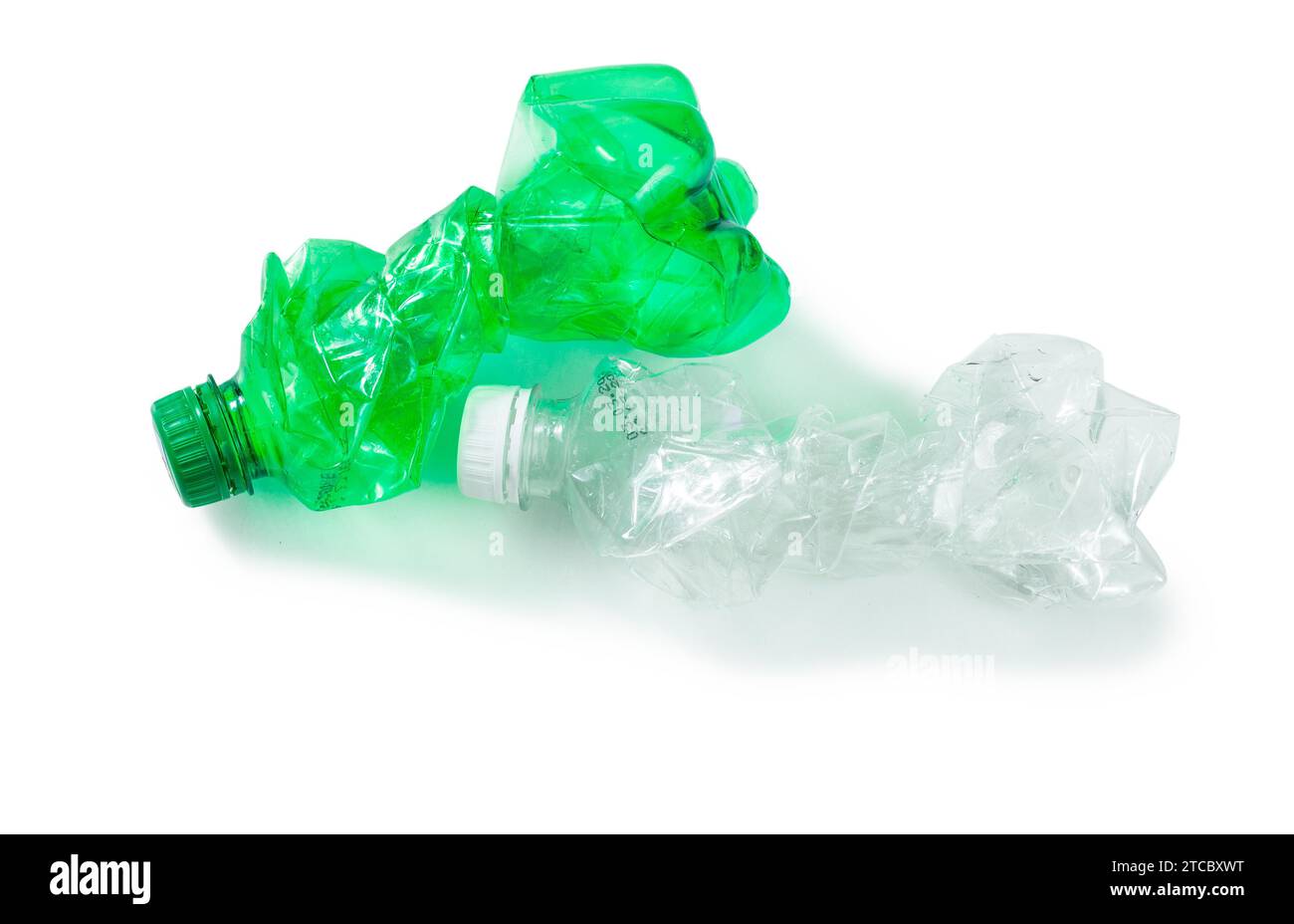 Crumpled plastic bottles on a white background Stock Photo - Alamy