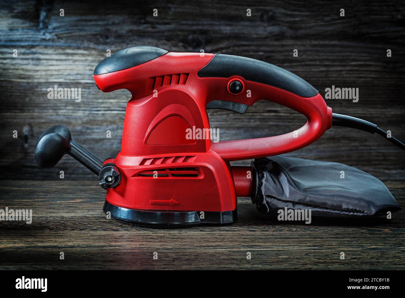 Electric hand tool wood sanding machine on dark vintage wood background ...