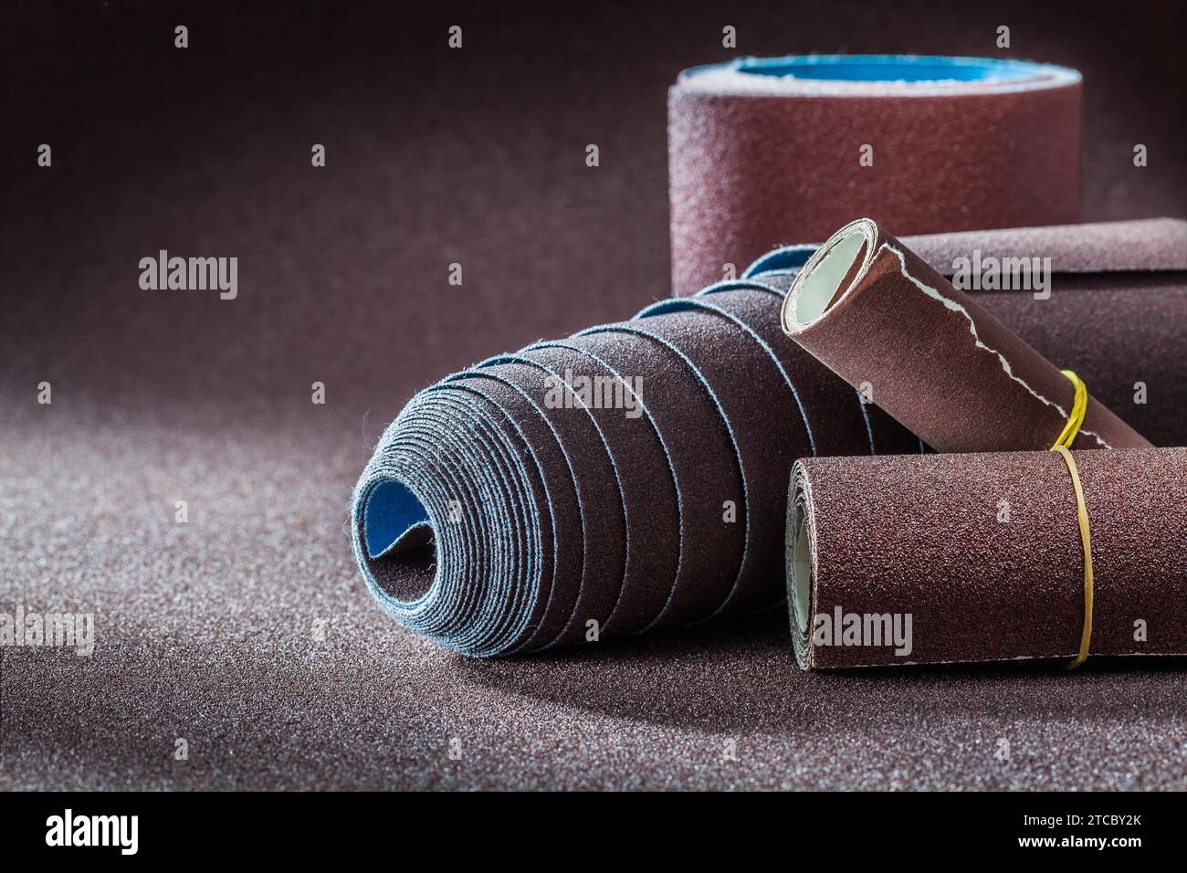 Four rolls of sandpaper on abrasive backing Stock Photo - Alamy