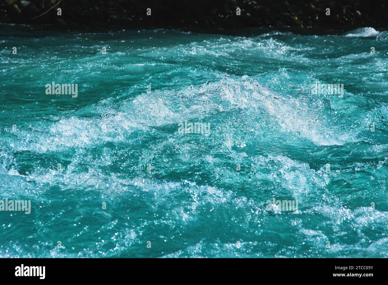 Crystal clear glacial water of the river of turquoise color. Close-up ...