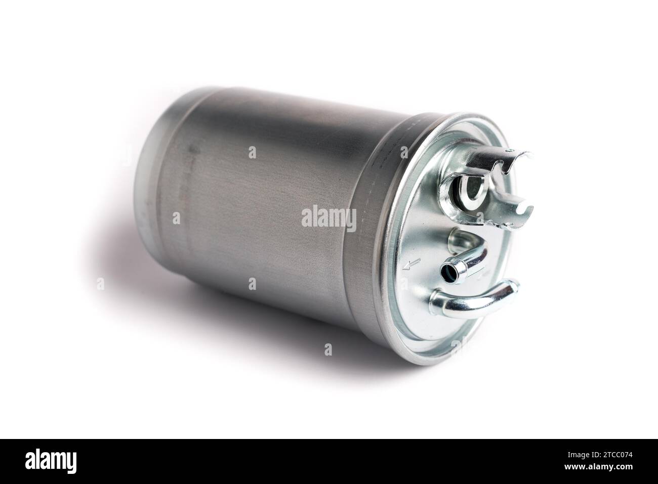 A new fuel filter enclosed in a metal casing with an inlet and outlet ...