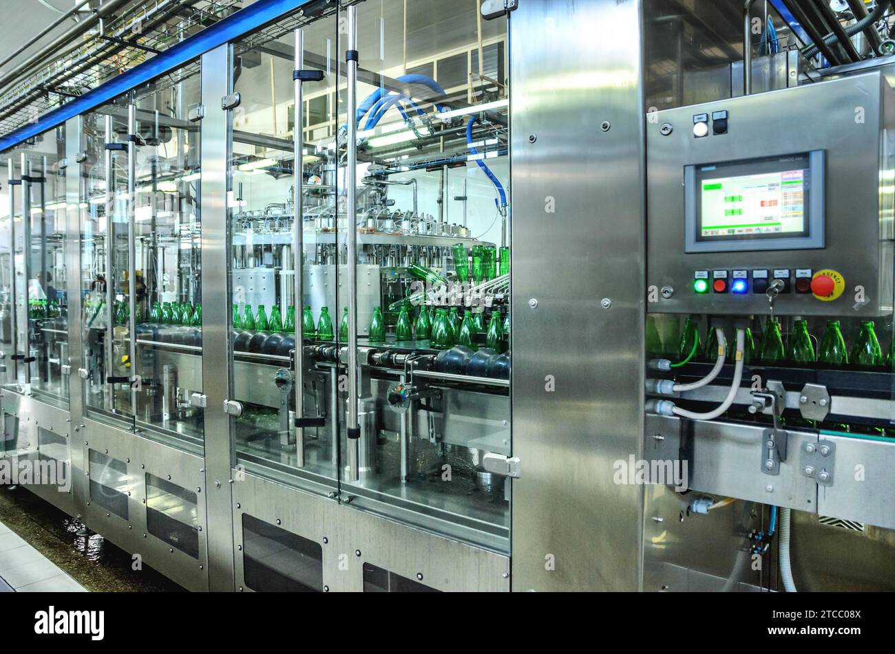 Water green bottling plant. Industrial conveyor of mineral water ...