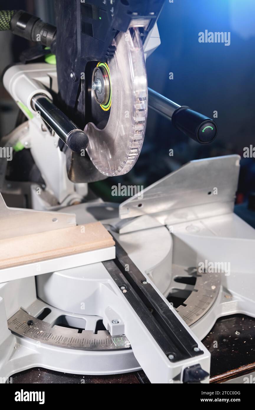 Close-up manual saw blade circular saw with plastic protection on the ...