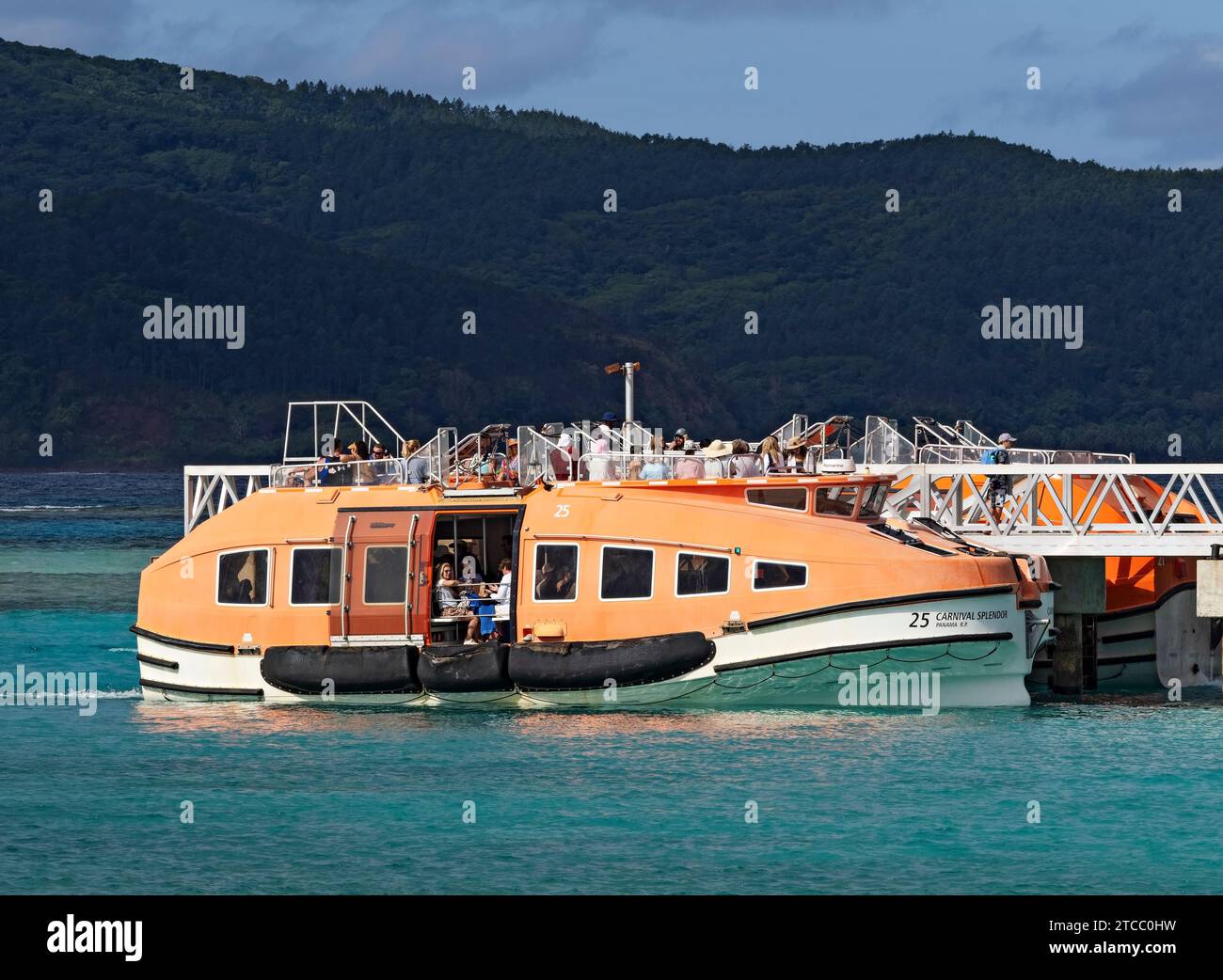 South Pacific Cruise / Cruise ship passengers aboard a tender boat from ...