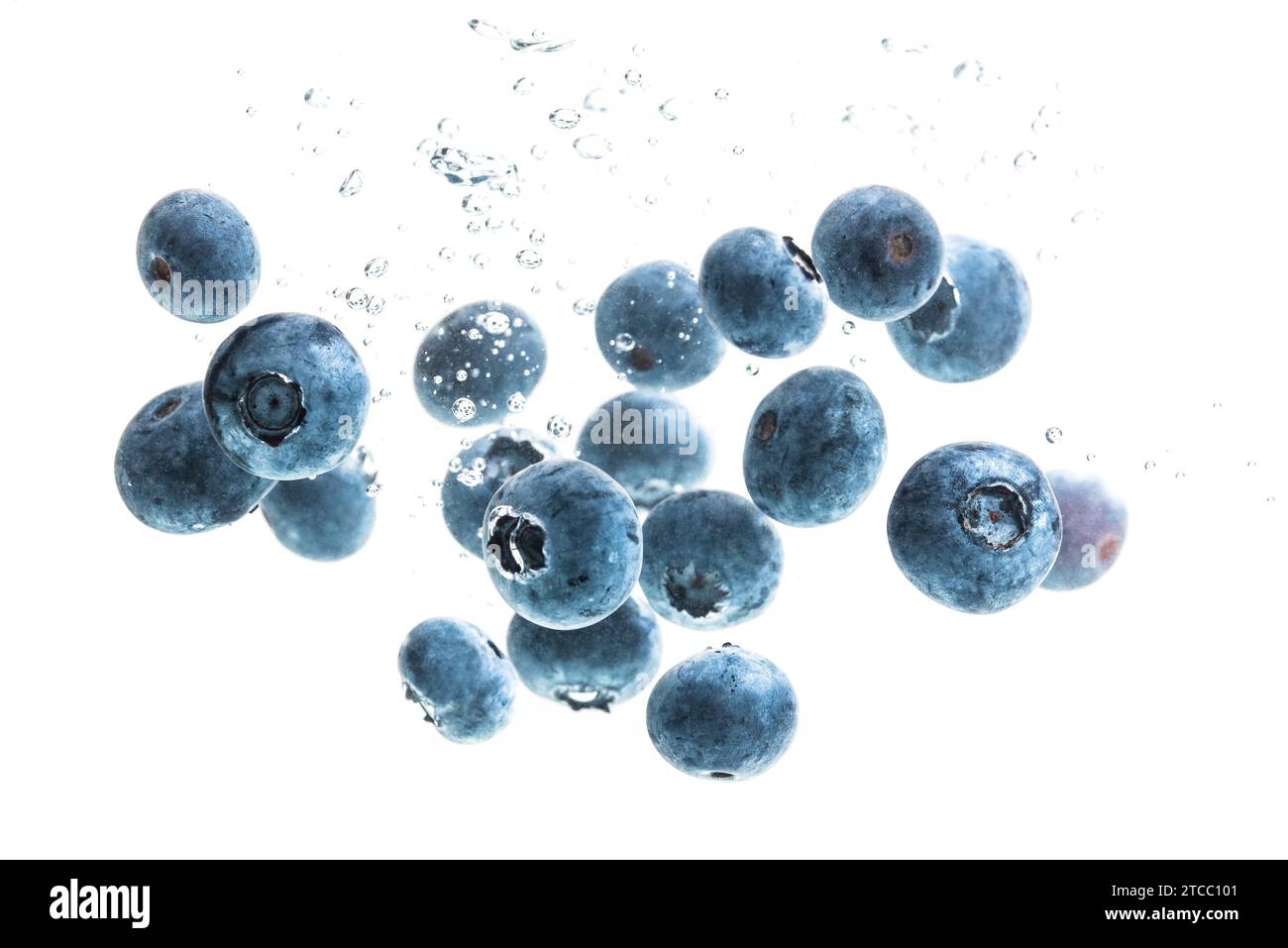 Blueberries sinking underwater with air bubbles isolated on white ...